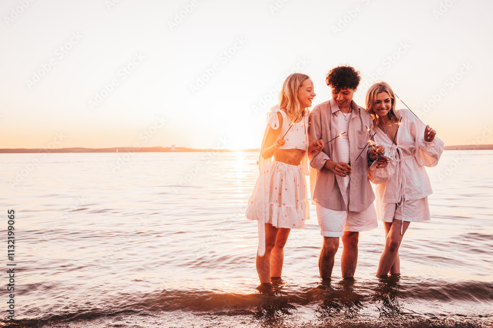 Young three smiling friends having fun during night party at the ...