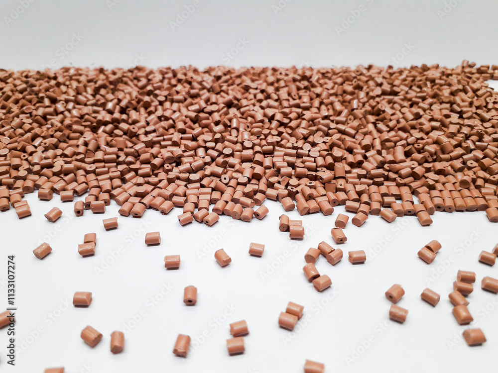 Milk chocolate color masterbatch granules on white background, color ...
