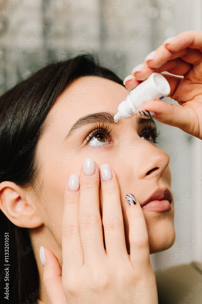 Girl using eye drops for treating dry eye. Young woman puts drops in ...