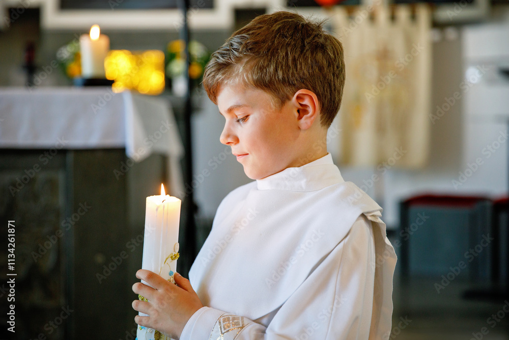 Stock-Foto „Little kid boy receiving his first holy communion. Happy ...