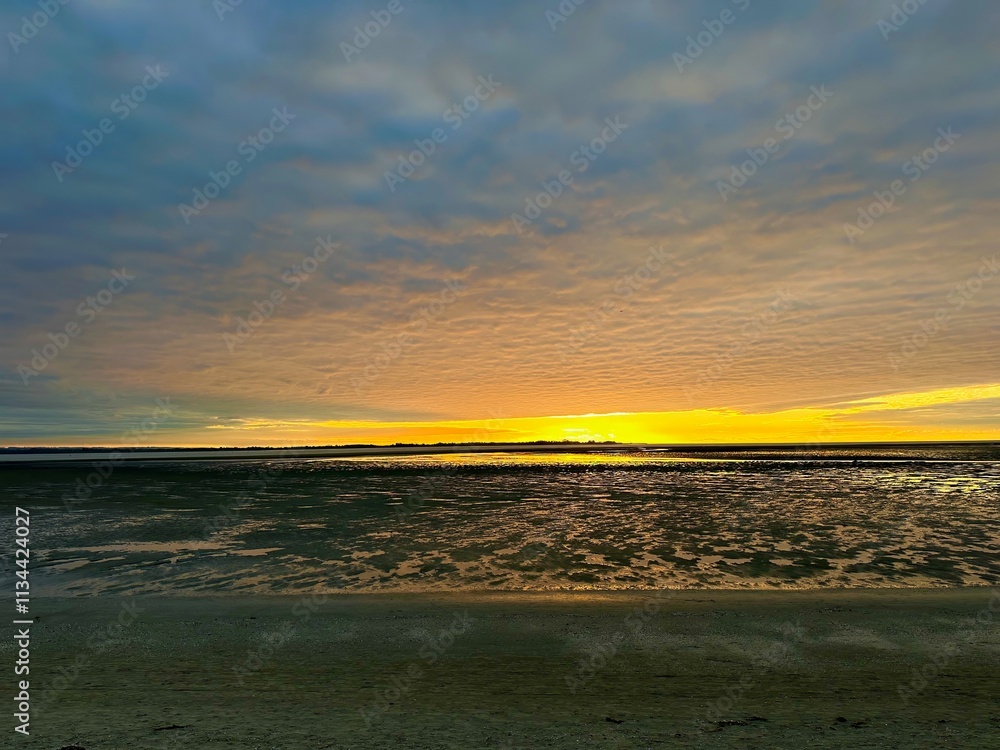 Vibrant Sunset Reflecting on the Bay of Somme’s Mudflats in October ...