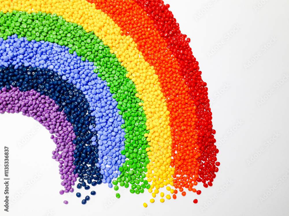Various colors of masterbatch granules arranged like a rainbow, polymer ...