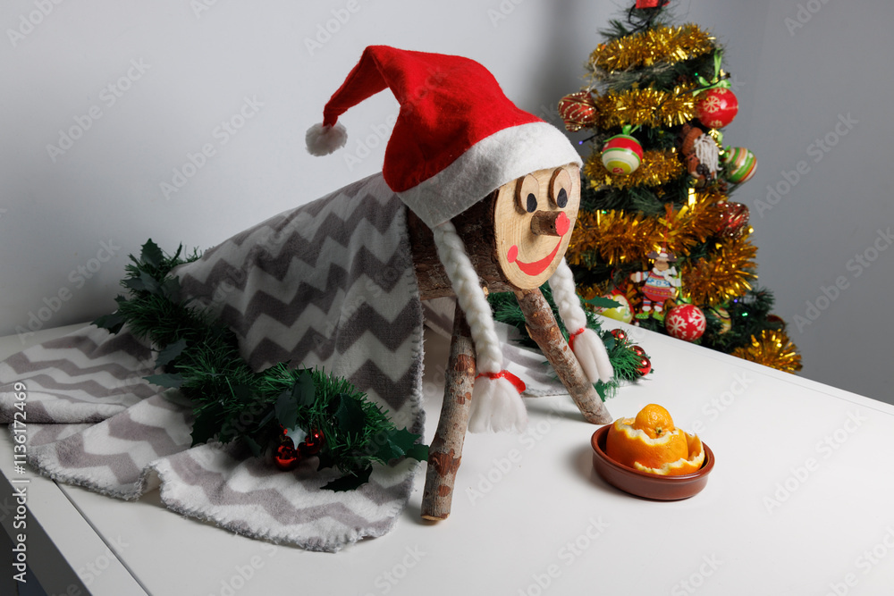 Stock-Foto „Tió de Nadal. A hollow log with a barretina, called Tió, is ...