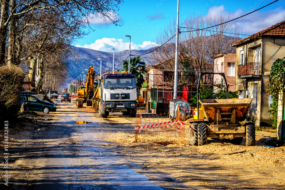 Ongoing Road Construction Project with Heavy Machinery and Workers ...