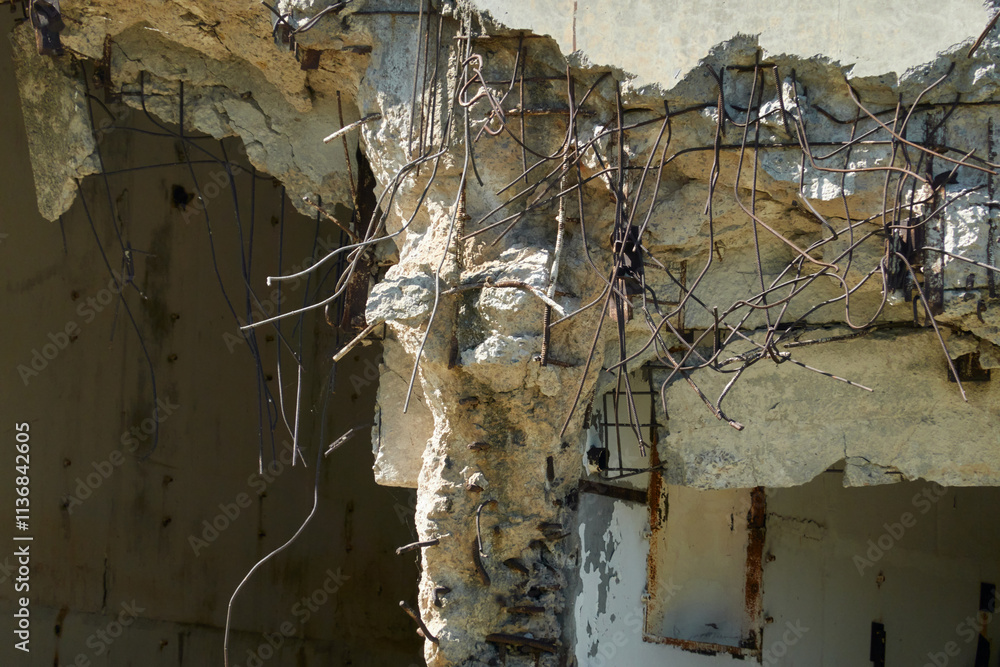 Dismantling of reinforced concrete structure. Hole in the wall with ...