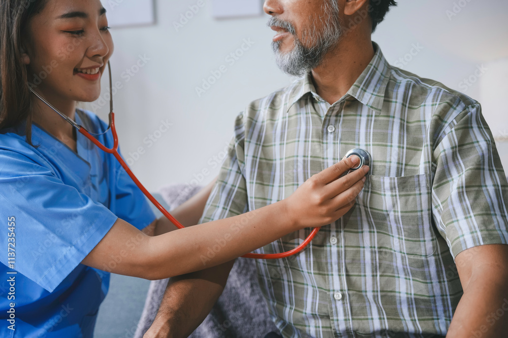 Smiling nurse using stethoscope examining heartbeat of senior patient ...
