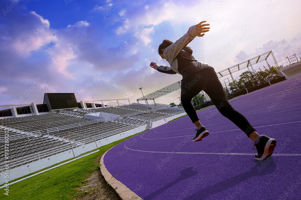 Fit young woman running sprinting at the racetrack. Fit runner fitness ...