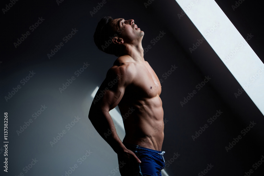 Fitness Hispanic Man Bodybuilder With Flexing Abs And Strong Body