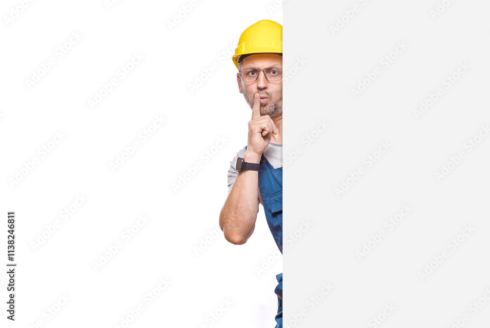 Hush. Construction worker holding finger on lips, keep the secret ...