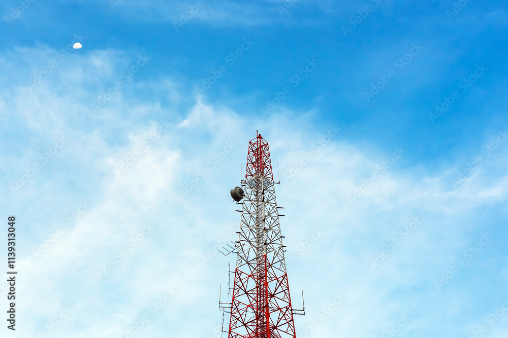 Mobile phone tower, base station or monopole with the moon in clear ...