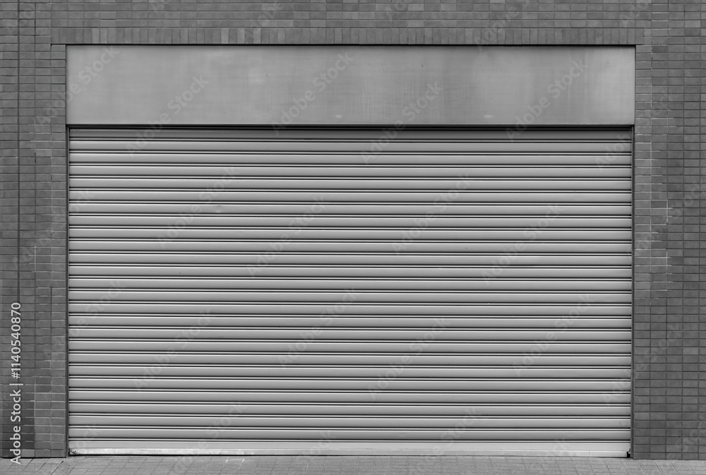 Closed steel shutter door of warehouse, storage or storefront for metal ...
