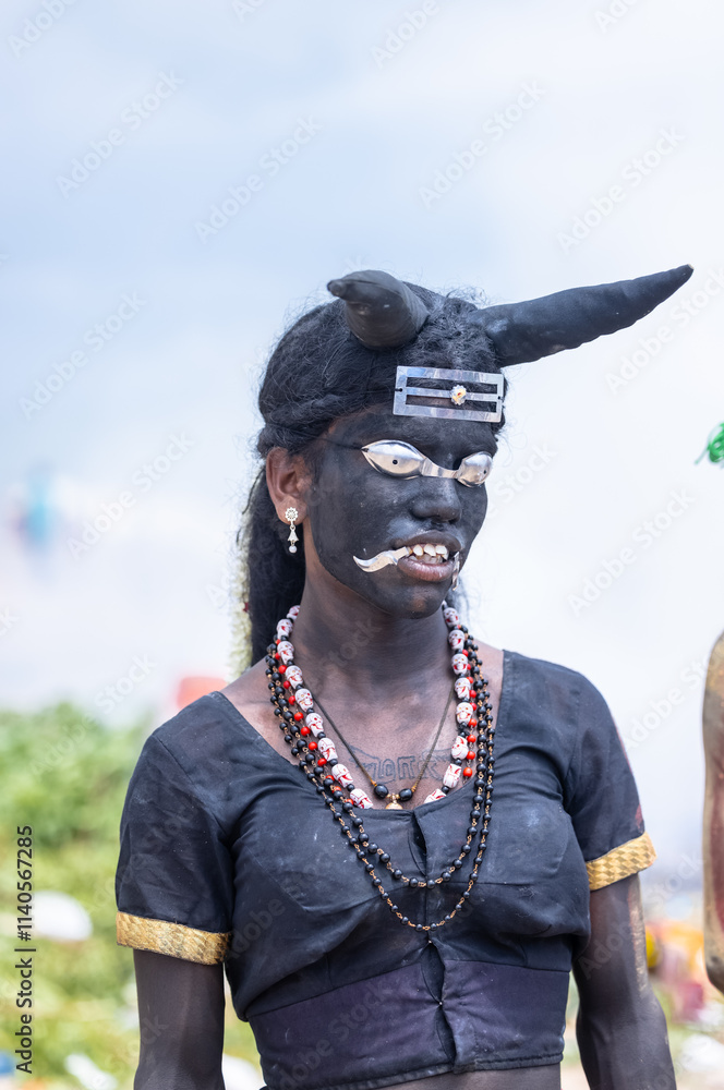 Kulasai Dasara, Portrait of indian male with painted face and dressed ...