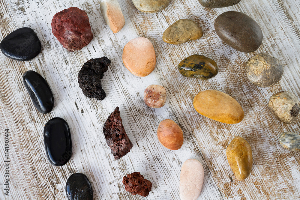 Collection of stones of different types on a gray background Stock ...