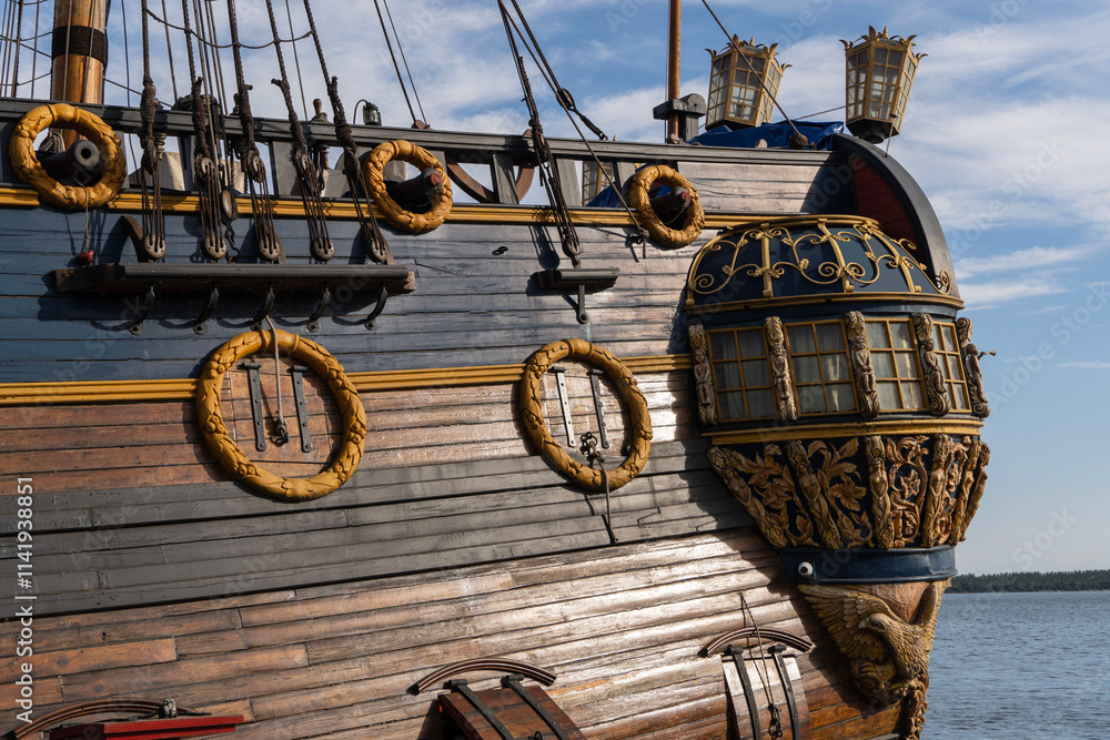 Ship-museum. Close-up of wood carving. Rear part of ship's hull is ...