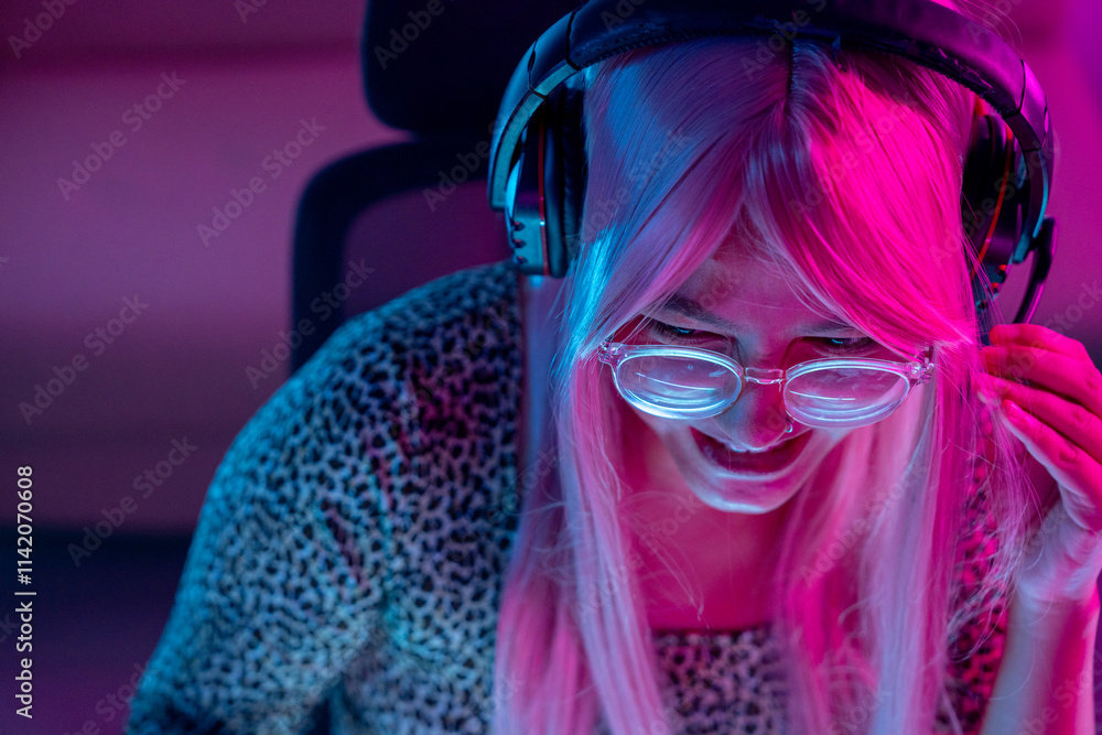 Professional gamer. Young asian pretty woman sitting on chair with ...