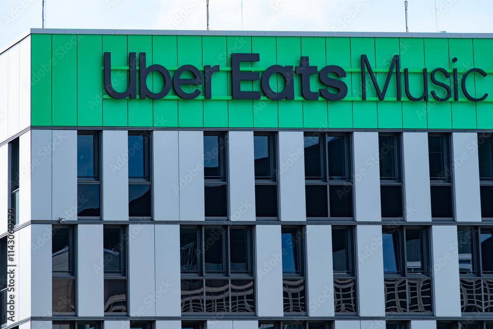 Uber Eats Music Hall Advertising logo on modern building facade, fusion ...