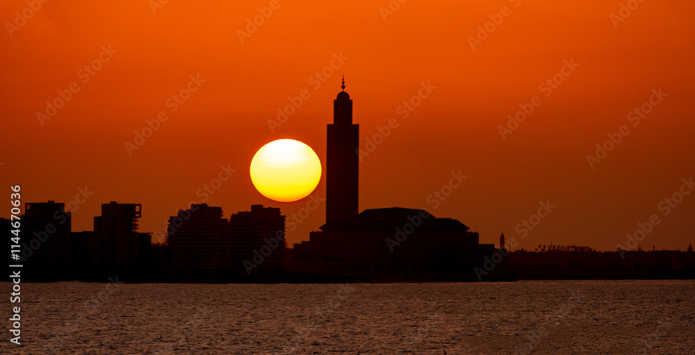 Gorgeous view of the sun right before sunset behind the iconic Hassan ...