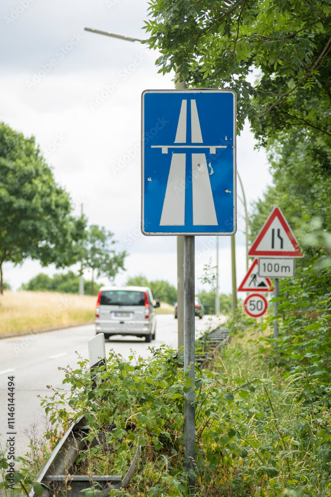 German motorway ramp with traffic signs Stock Photo | Adobe Stock