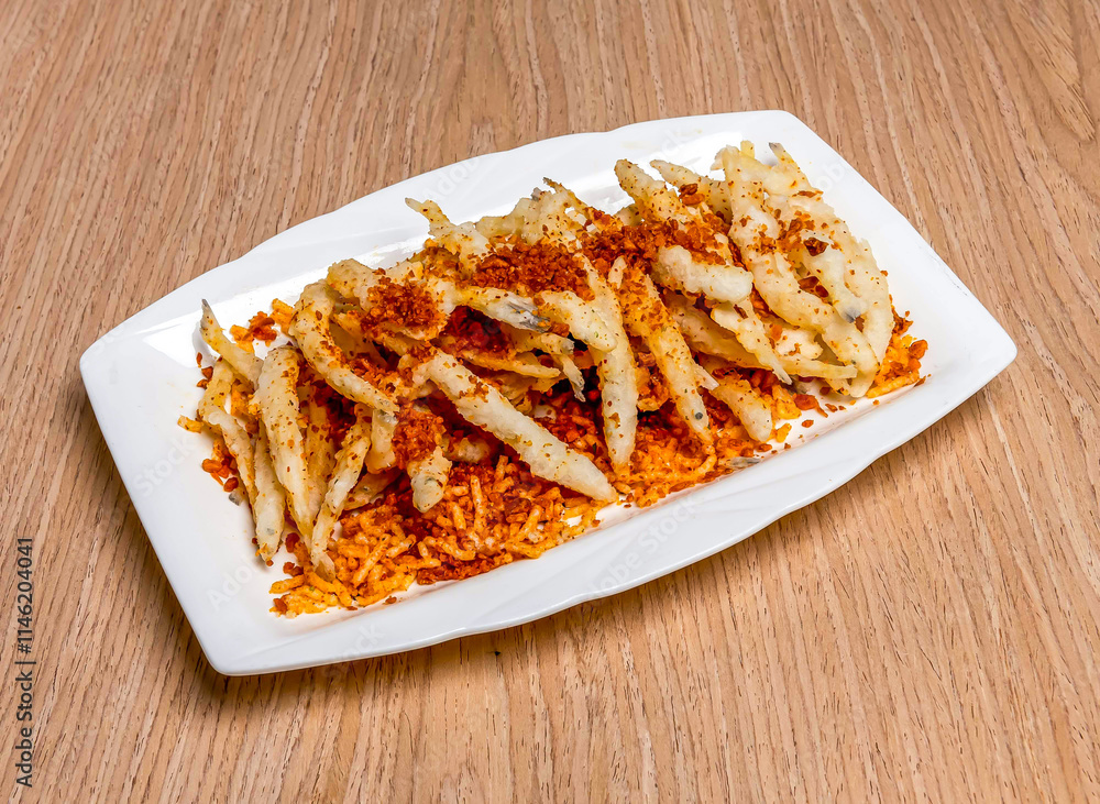 Deep fried Chinese Spicy noodle fish with spice salt served in tray ...