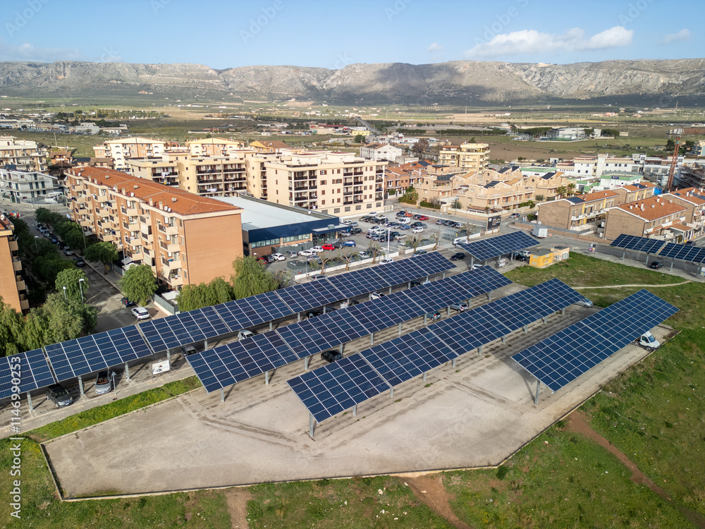 Drone photo of solar panels above a parking lot in Italy for renewable ...