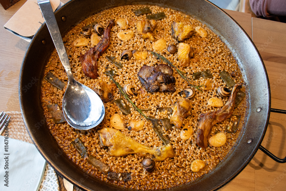 Foto de Stock Spanish Valencian paella of traditional rice with chicken ...
