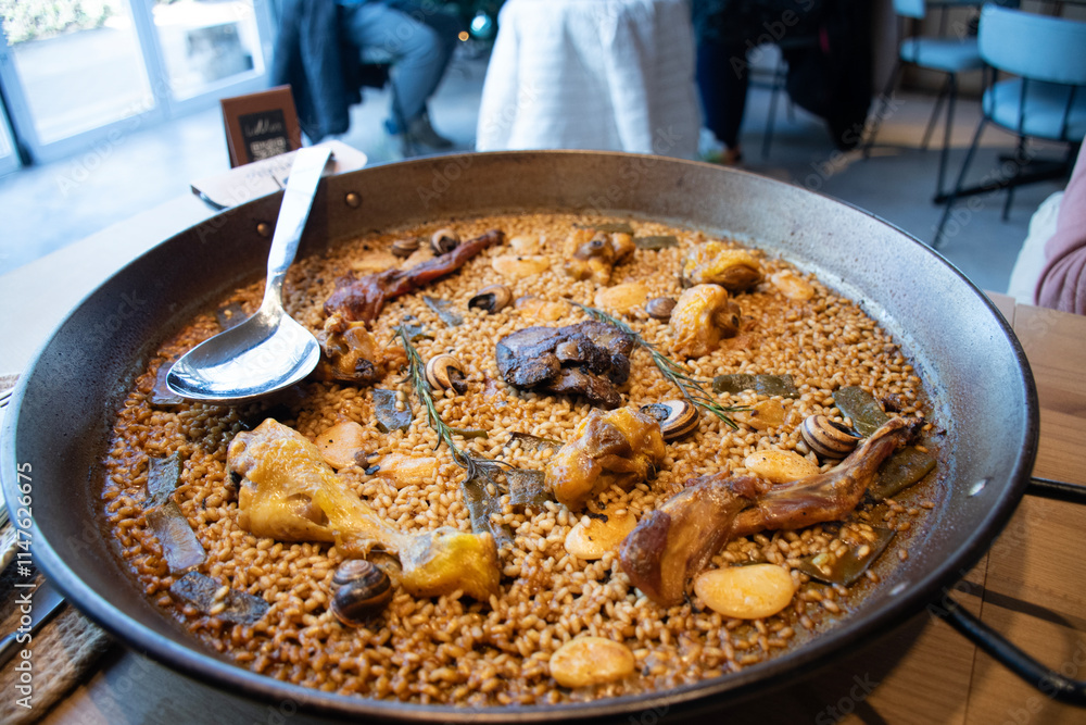 Spanish Valencian paella of traditional rice with chicken lamb escargot ...