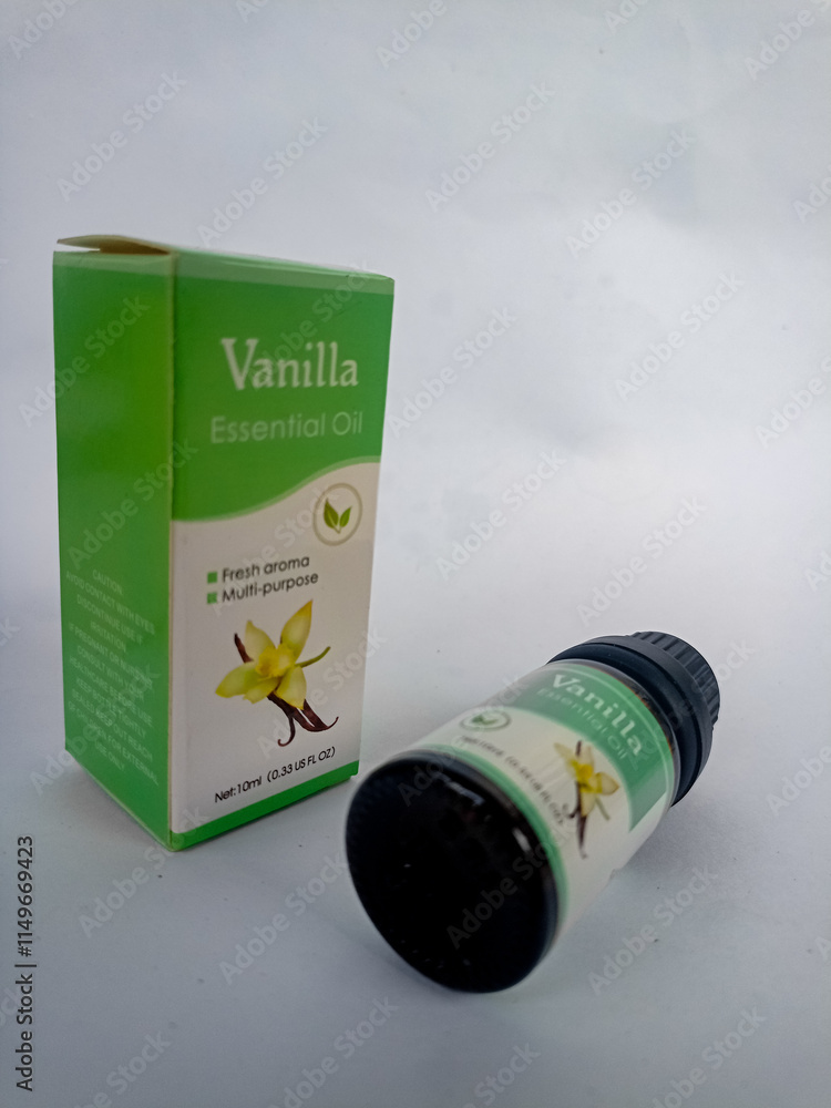 Bottle of essential Vanilla oil on isolated white Background. Medicinal ...