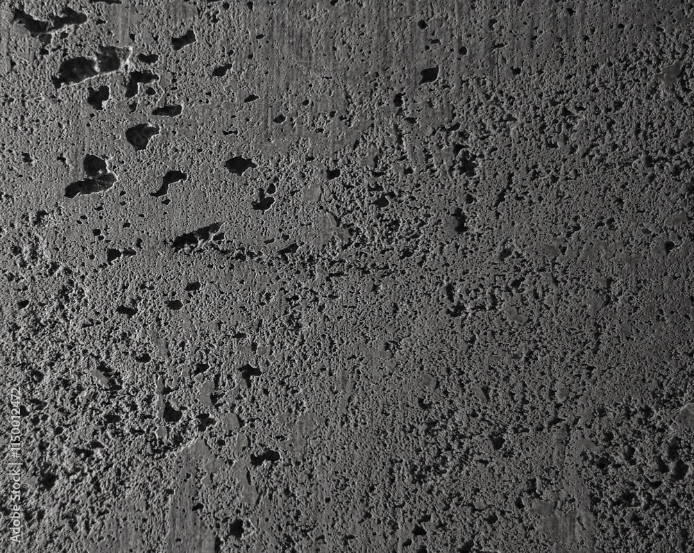 dark rough raw concrete wall texture with surface voids small holes ...