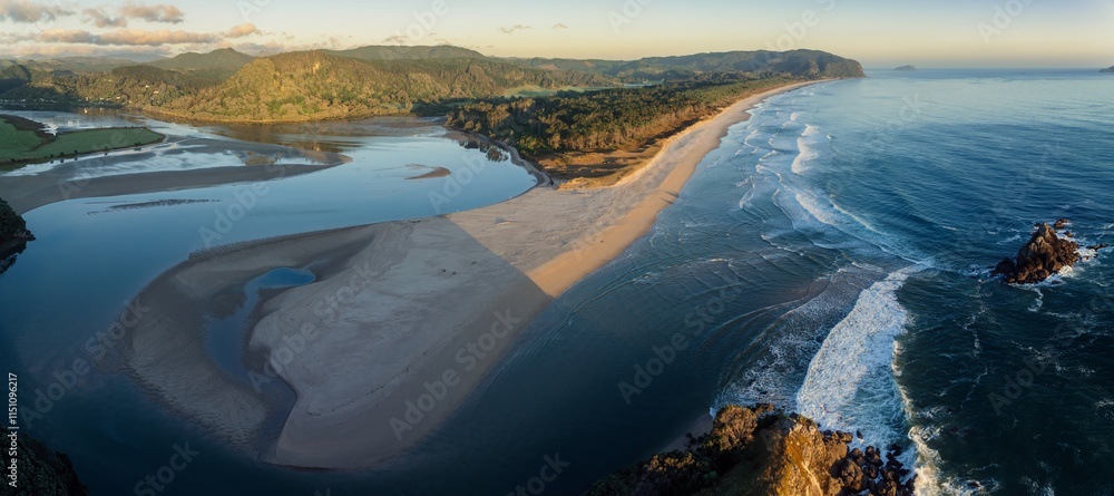 Aerial view of a stunning coastal estuary at sunrise. Sandy spit ...