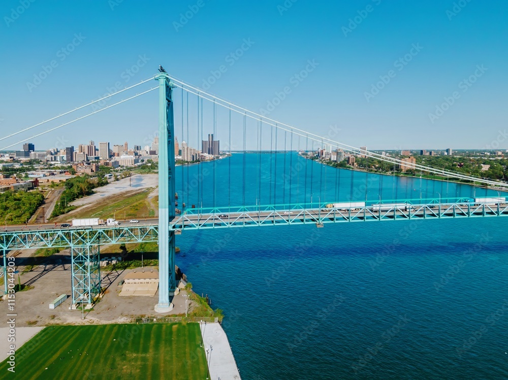 Aerial view of the Ambassador Bridge over the Detroit River. Trucks ...