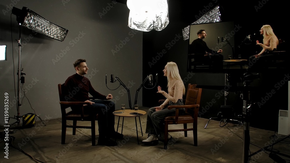 Backstage shot man host and woman guest recording interview in stylish ...