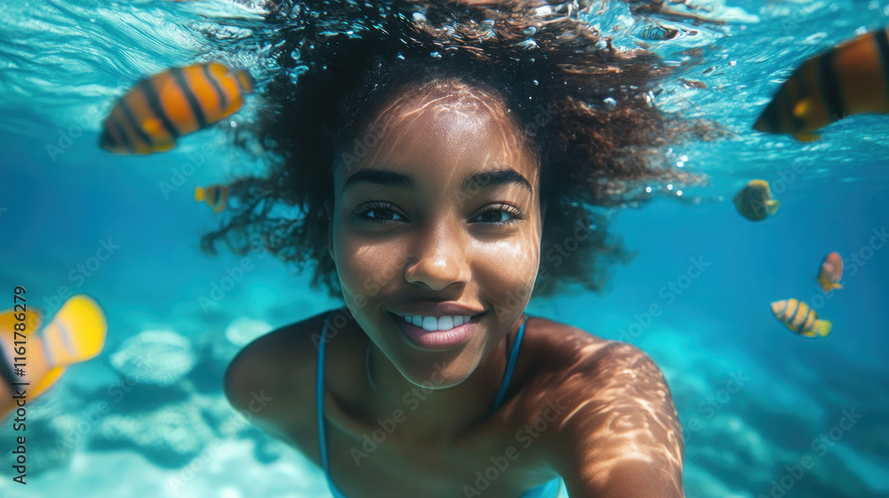 African woman swimming dive underwater at coral reefs with fishes Stock ...