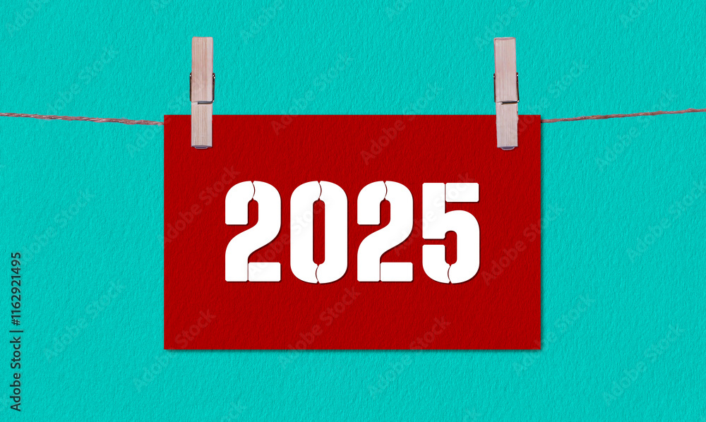 2025 Symbol. Concept words 2025 on Red Rectangle Paper Hanging on a ...
