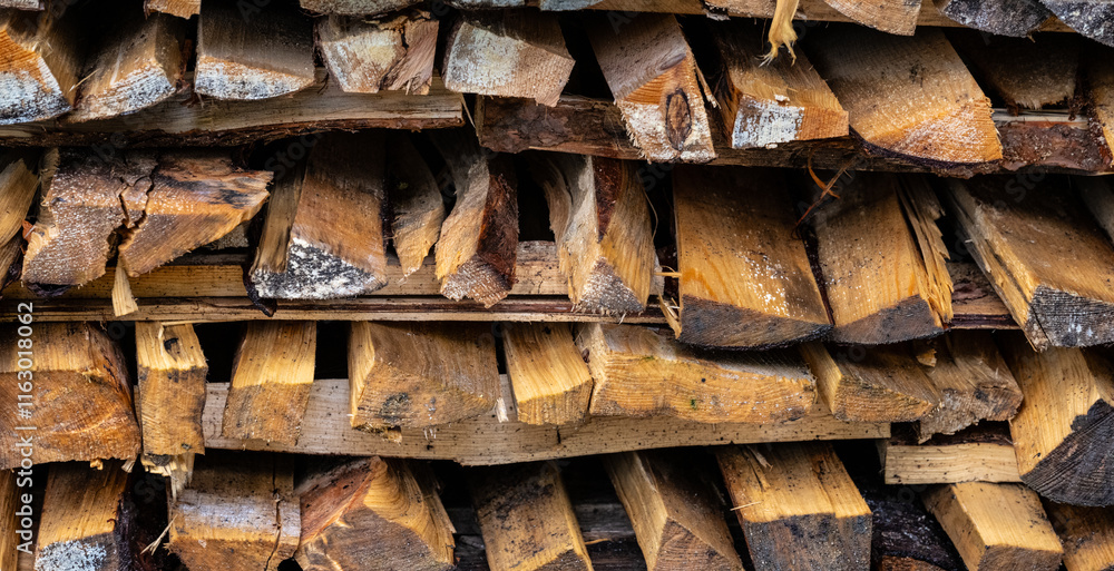 Neatly stacked fire wood on pallets. Stock Photo | Adobe Stock