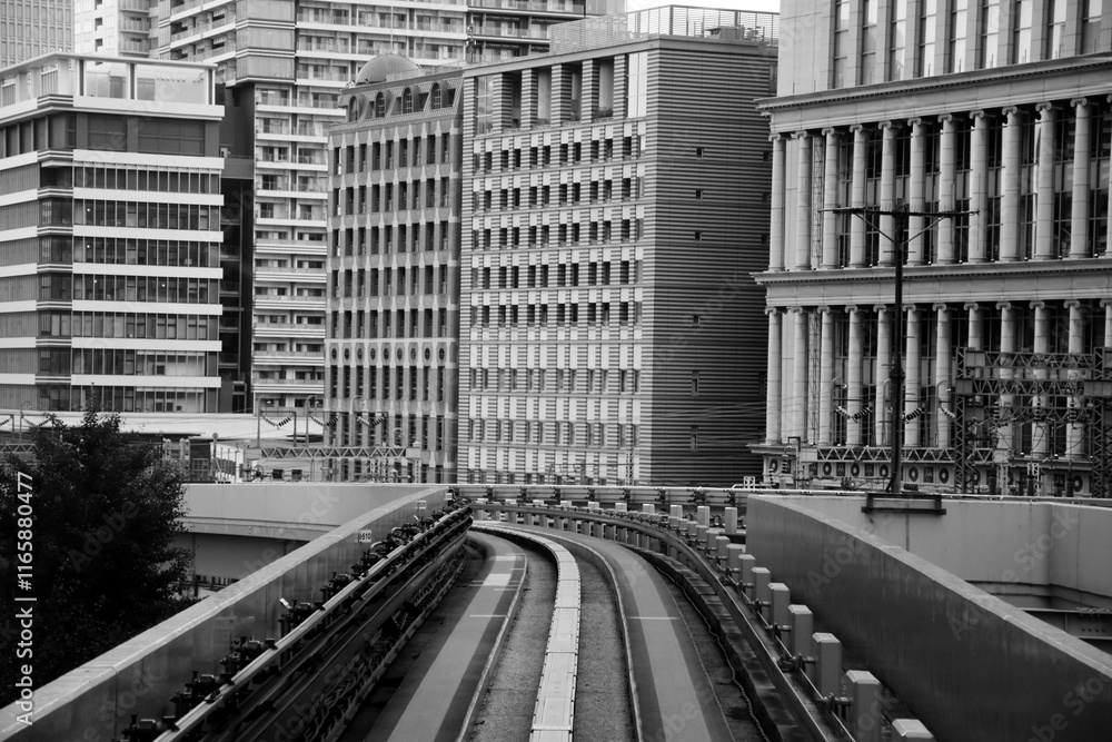 Curved monorail tracks pass between modern and traditional-style ...