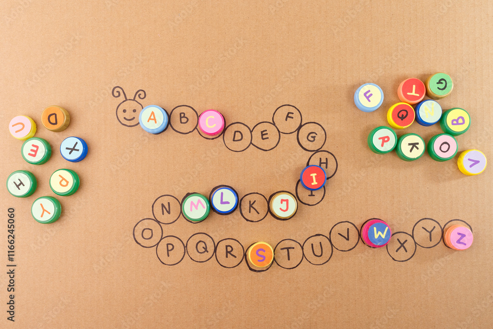 Foto de Stock Cardboard caterpillar alphabet learning activity, letter ...
