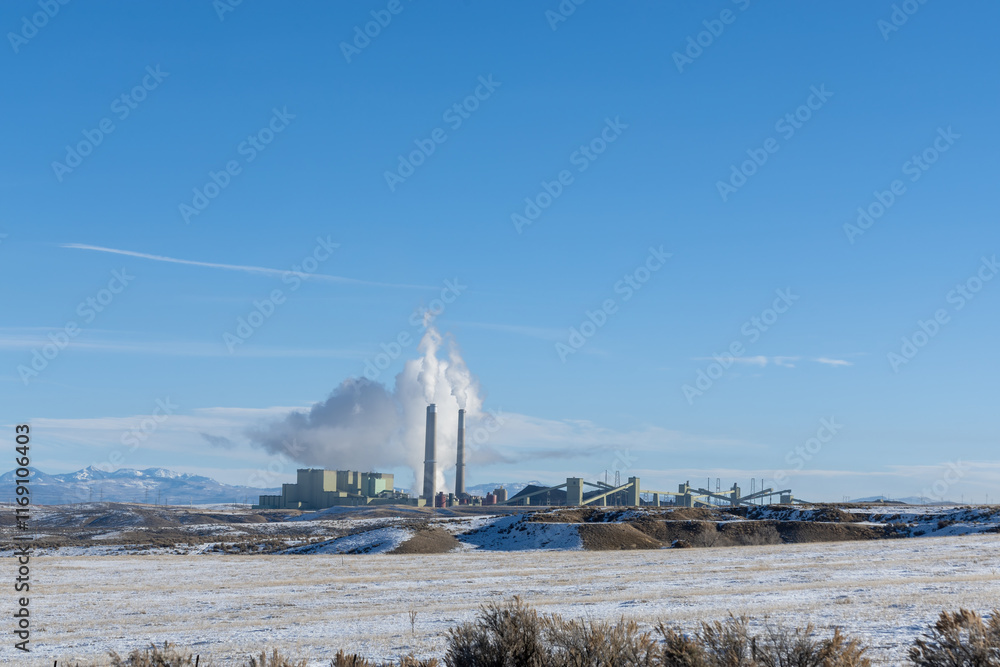 Industrial complex with many smoke stacks spewing smoke for air ...