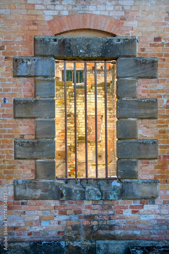 Old brick wall with barred window, showcasing historic architecture and ...