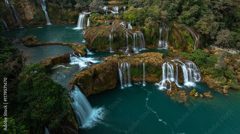 Located on the Vietnam - China border, Ban Gioc waterfall is known as ...
