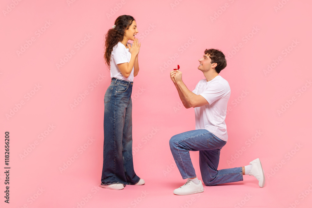 Romantic man kneeling making proposal to his beloved girlfriend, guy ...
