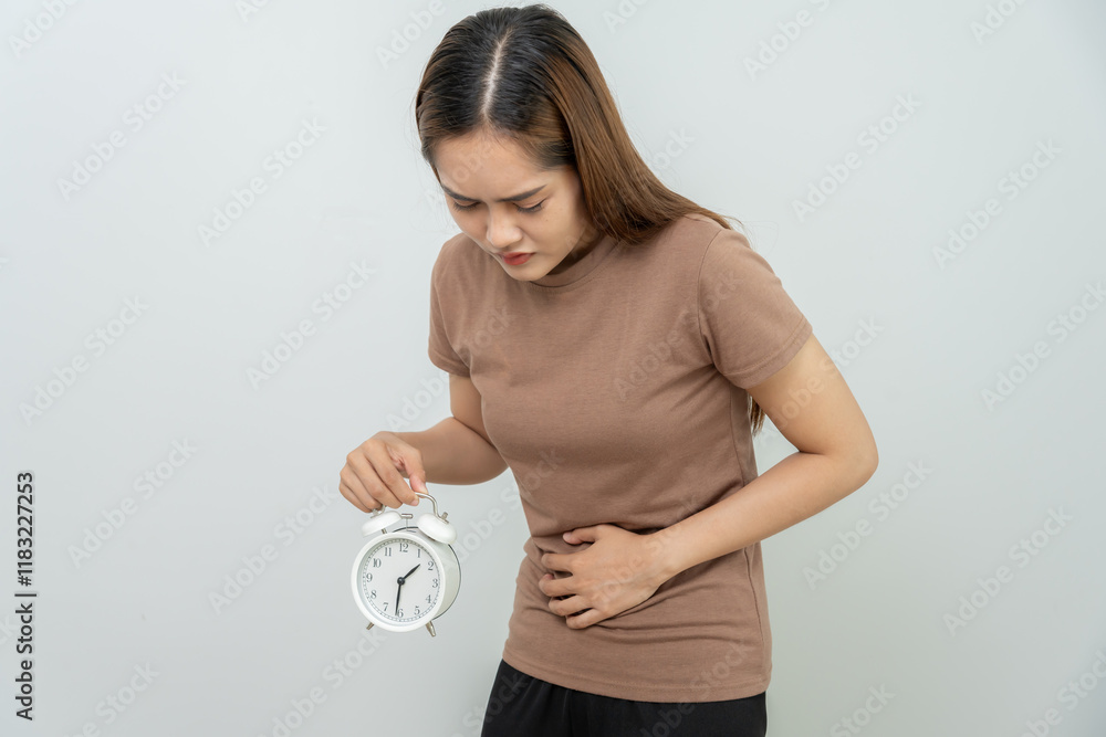 Asian women have stomach ache. Stomach ache due to eating irregularly ...