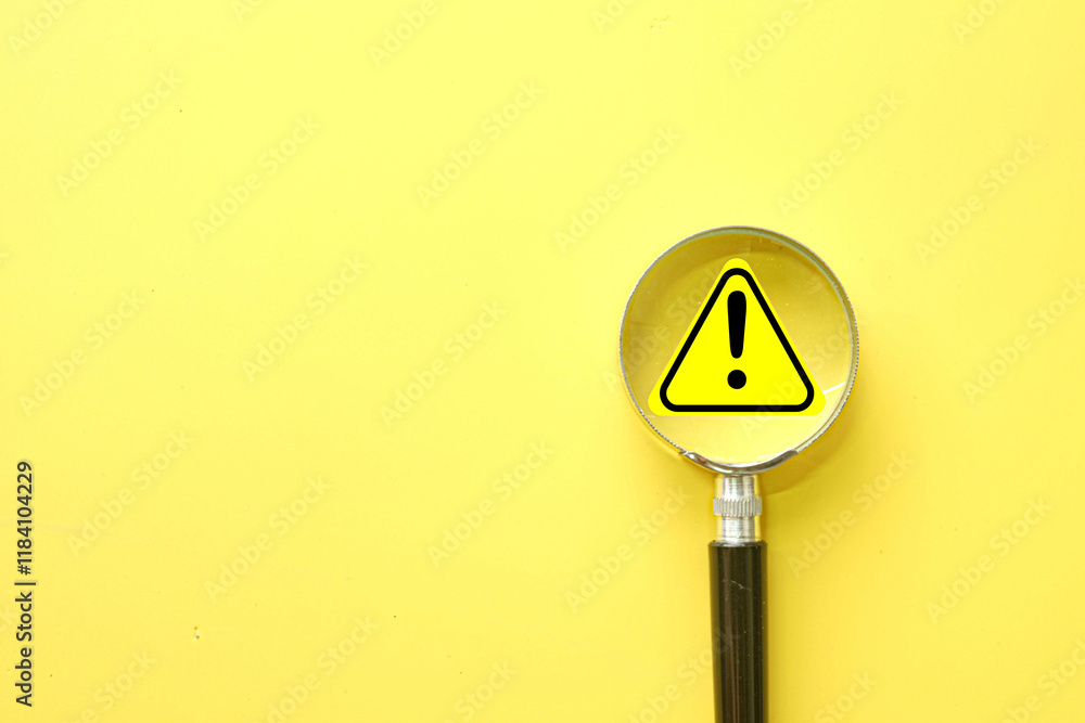 Attention symbol under magnifying glass use for for safety alerts ...