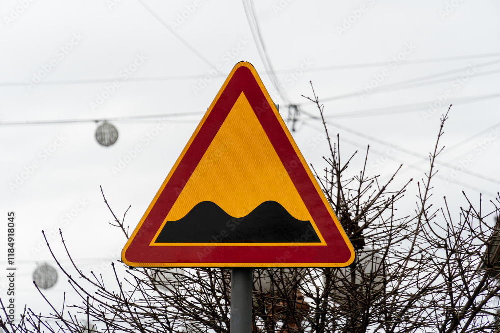 Foto de Stock Warning sign rough road. Red triangle sign with a ...
