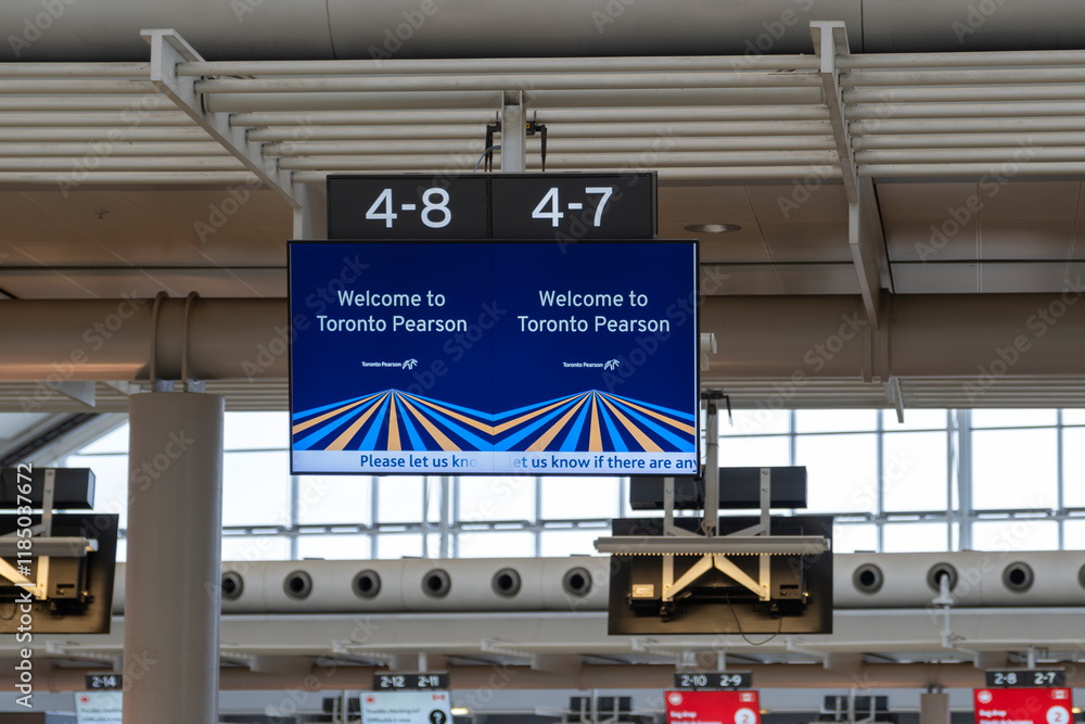 Sign on screen welcome to Toronto Pearson with the logo at the Toronto ...