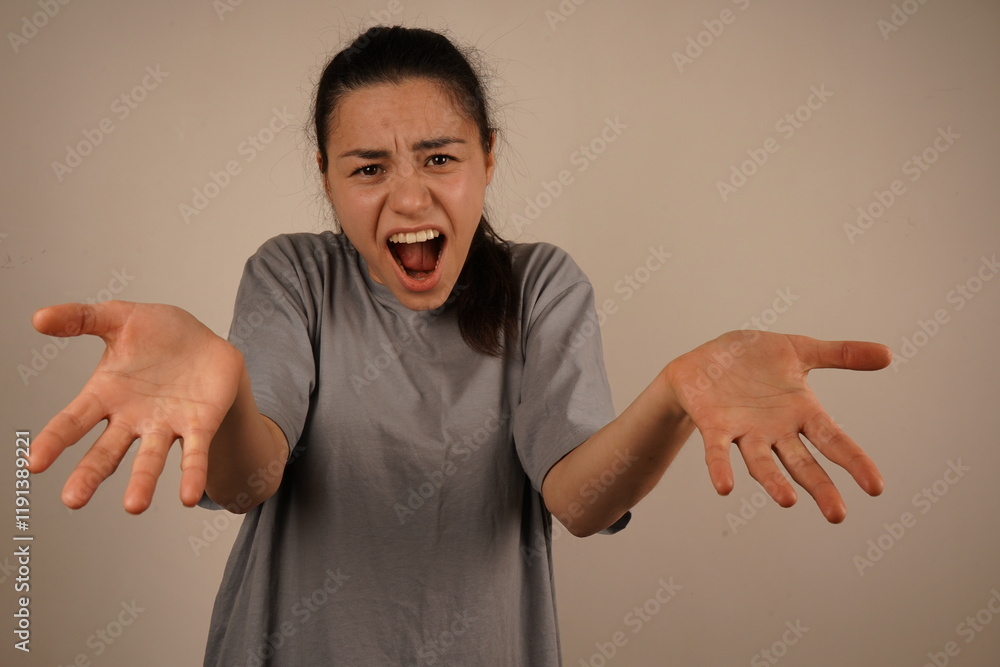 Her bewildered body expression reveals uncertainty. The gesture ...