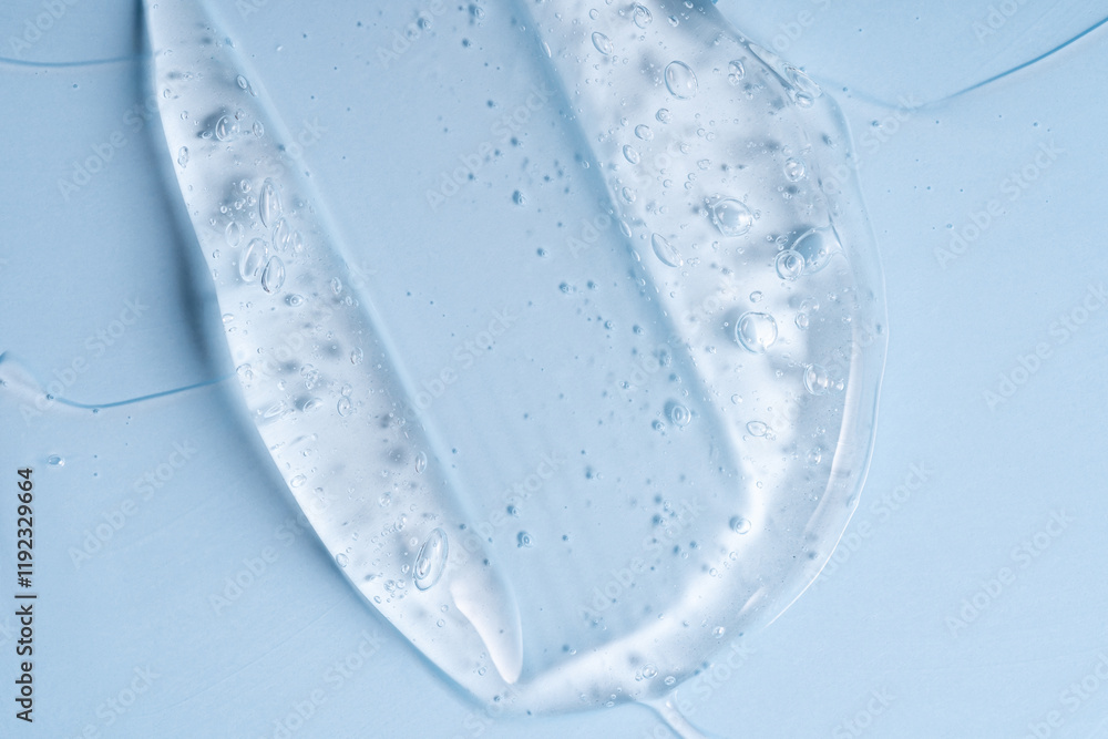 Liquid gel abstract cosmetic in blue background. Smear of transparent ...