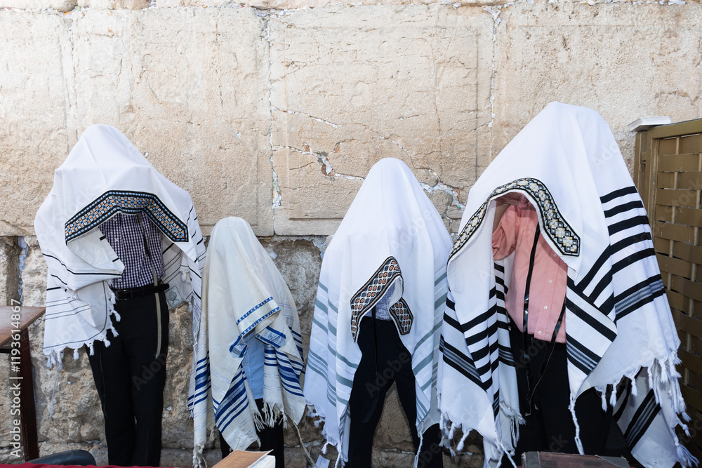Cohanim or Jewish priests cover their heads with their prayer shawls ...