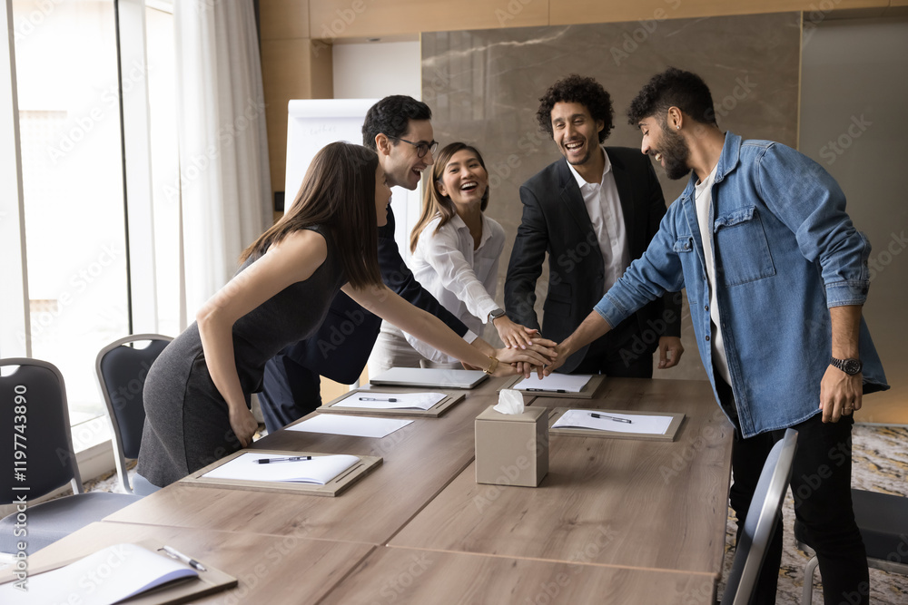 Five multiethnic teammates celebrate shared joint achievement stack ...