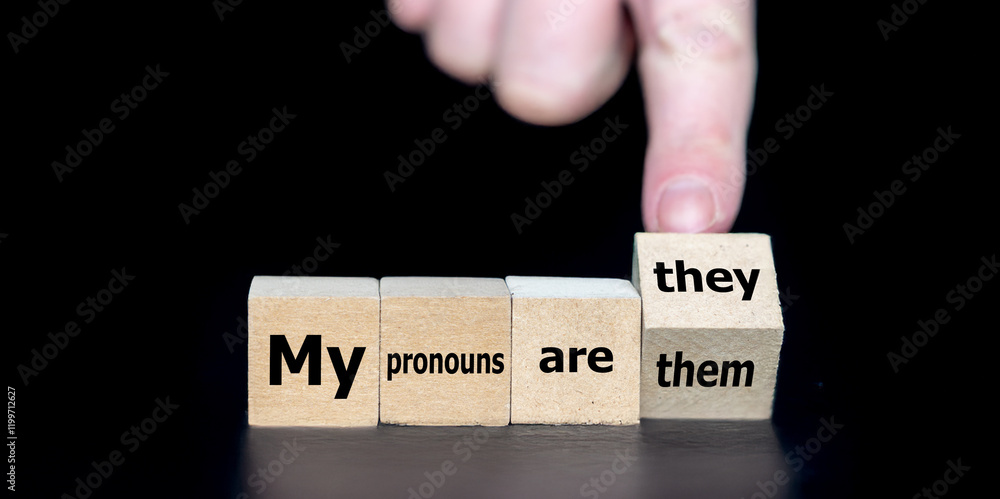Cubes form the expression 'my pronouns are they them'. Symbol for ...