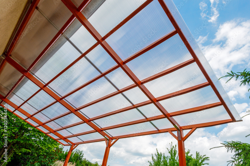 Transparent polycarbonate roof on a modern wooden pergola structure in ...